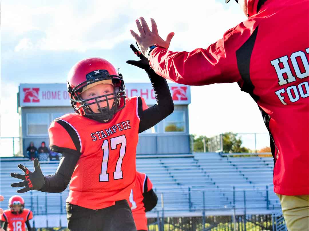 Holly Stampede Football Player High Five - Photo Gallery